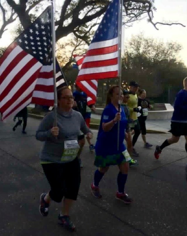 Runners Carry Flags To Honor Loved Ones Lost Too Soon